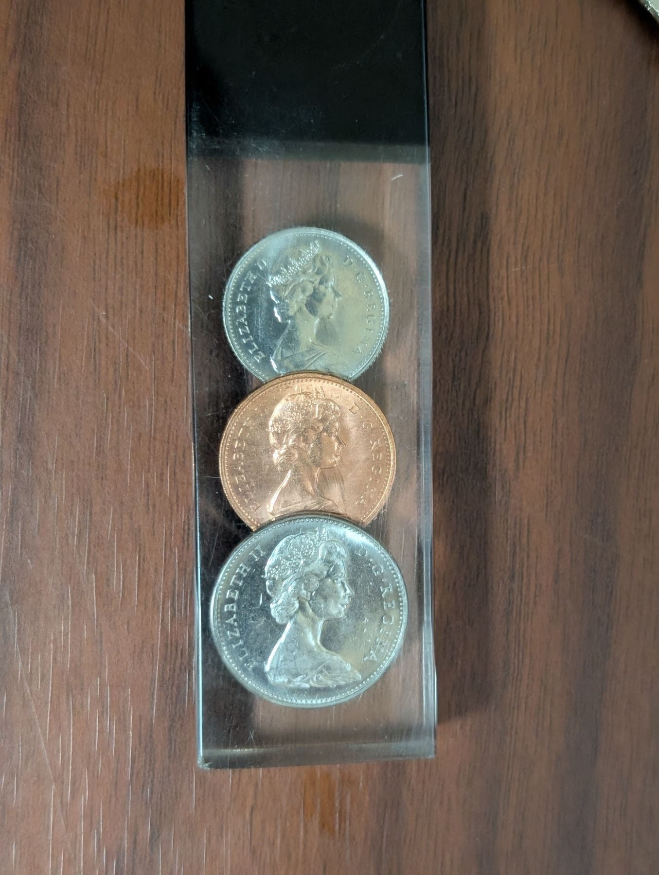 Letter Opener With Coins, Roll of Pennies, and etc. Lot - Schmalz Auctions