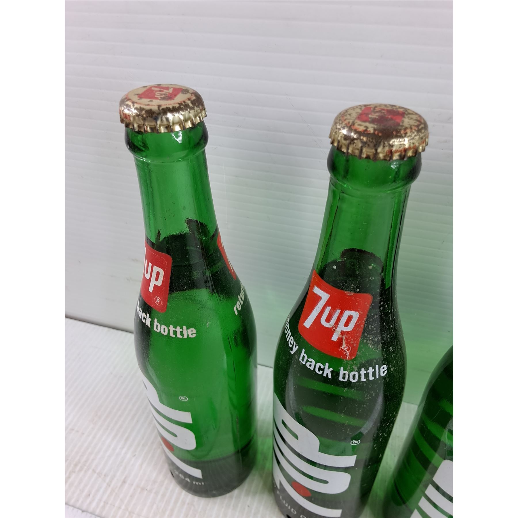 (4) Vintage 7Up Bottles - Sealed, PICKUP ONLY - Bodnarus Auctioneering