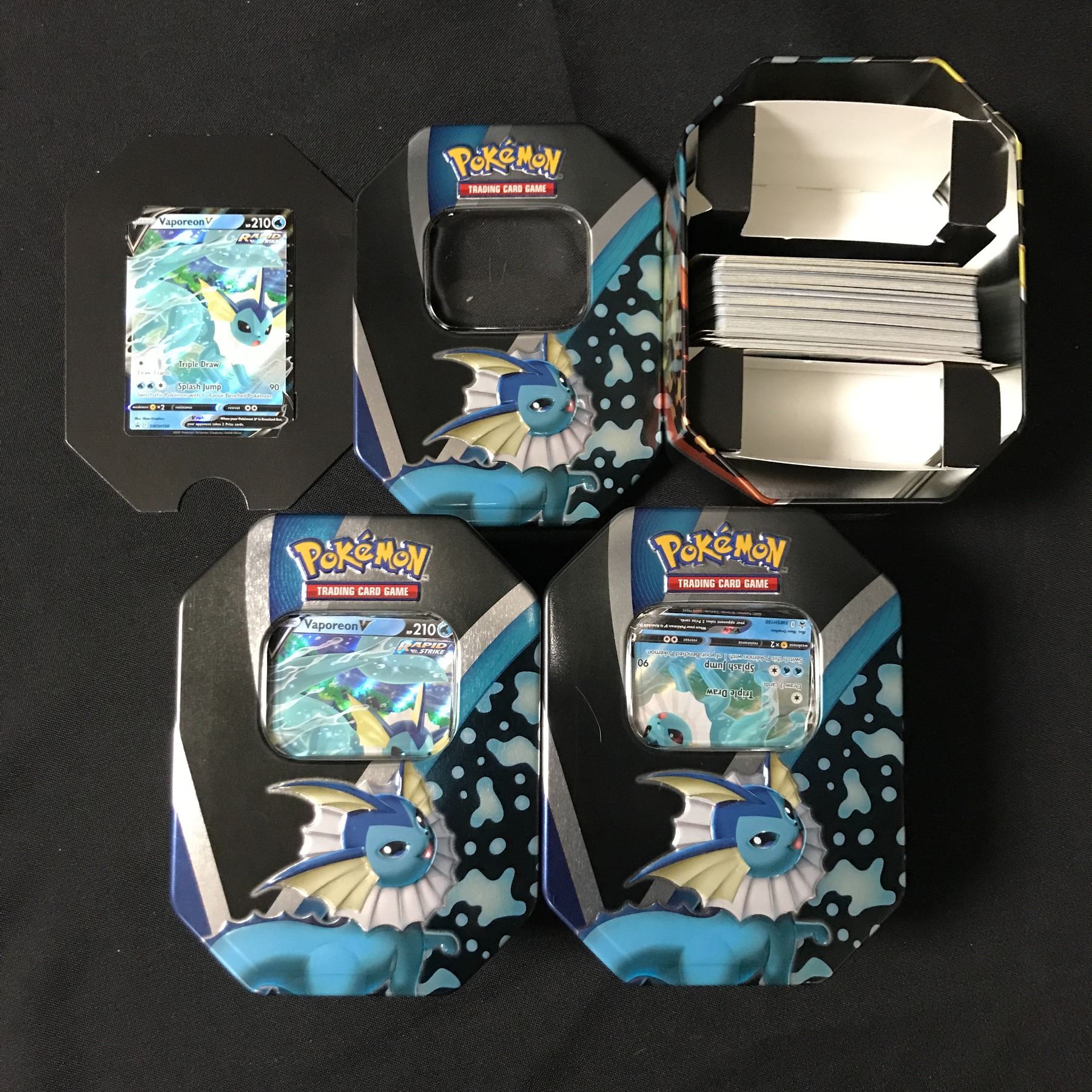 LOT OF 3 VAOPERON TINS 1 VAPOREON TRADING CARD AND SEVERAL LOOSE CARDS