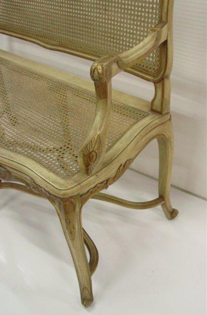 Paint decorated carved cane back loveseat