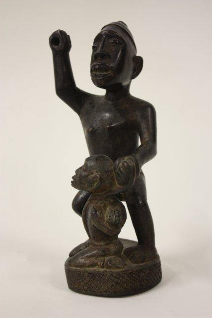 African statue "Man Chopping off Head"