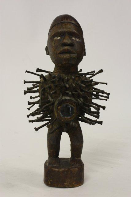 African wood statue with nails