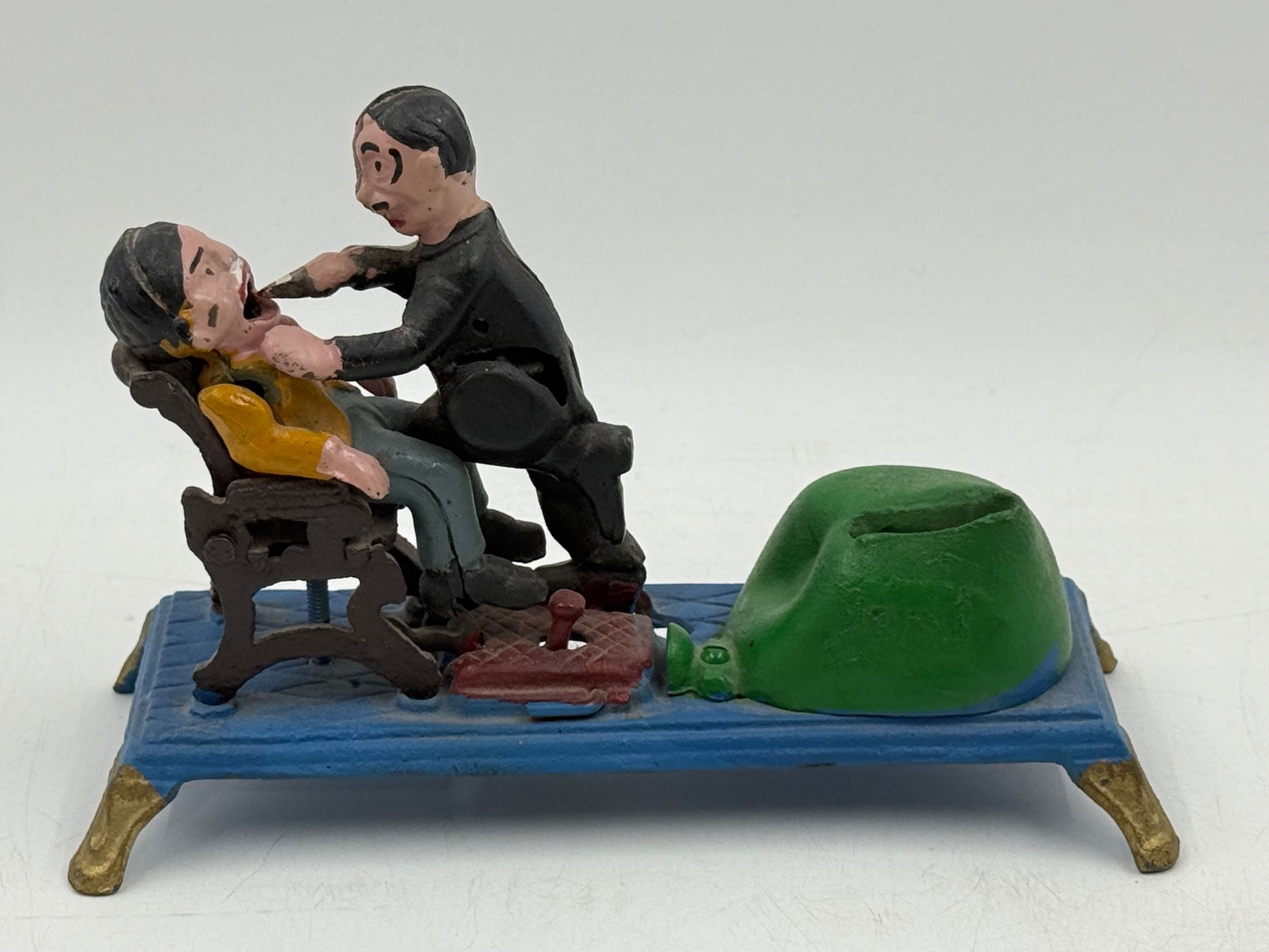 Cast Iron Dentist Pulling Teeth Mechanical Bank