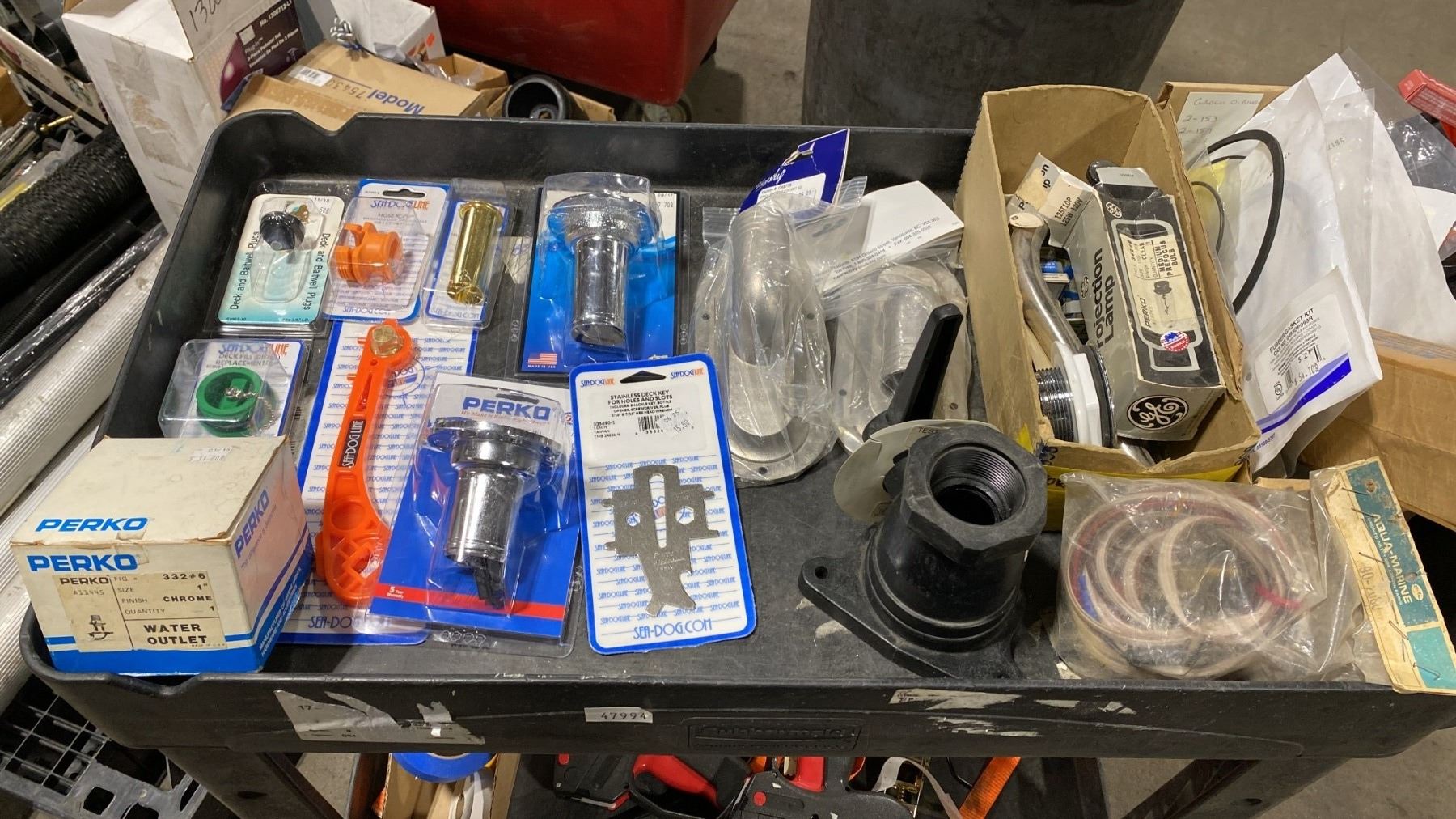 BIN OF ASSORTED MARINE RETAIL PARTS- WATER OUTLETS, THRU HULL INSERTS ...