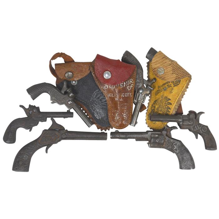 Toy cap guns (7), all cast iron, Dent Big Chief in holster, Cowboy ...