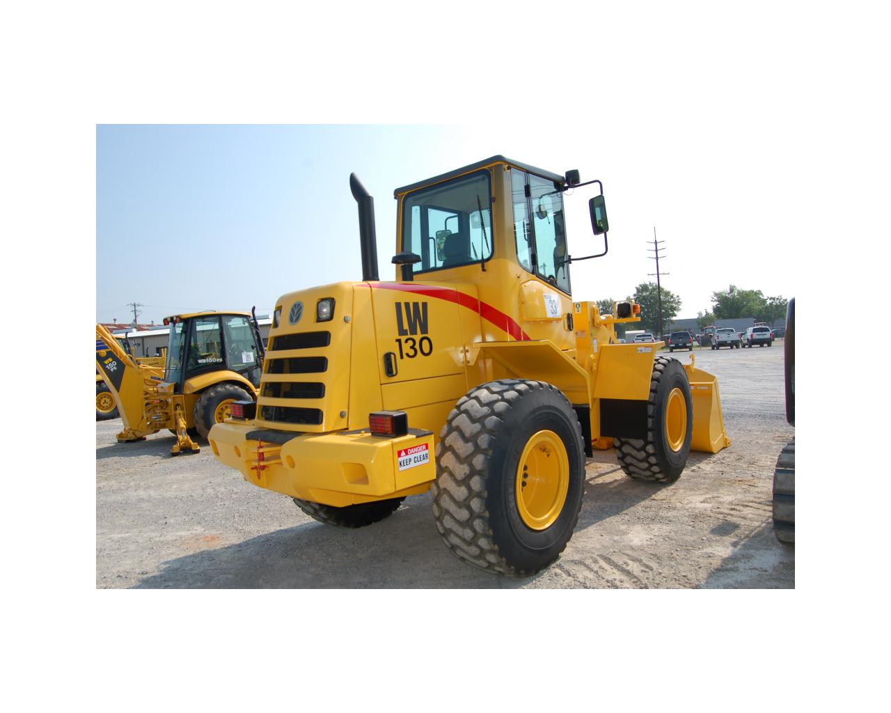 NEW HOLLAND LW 130 WHEEL LOADER - J.M. Wood Auction Company, Inc.