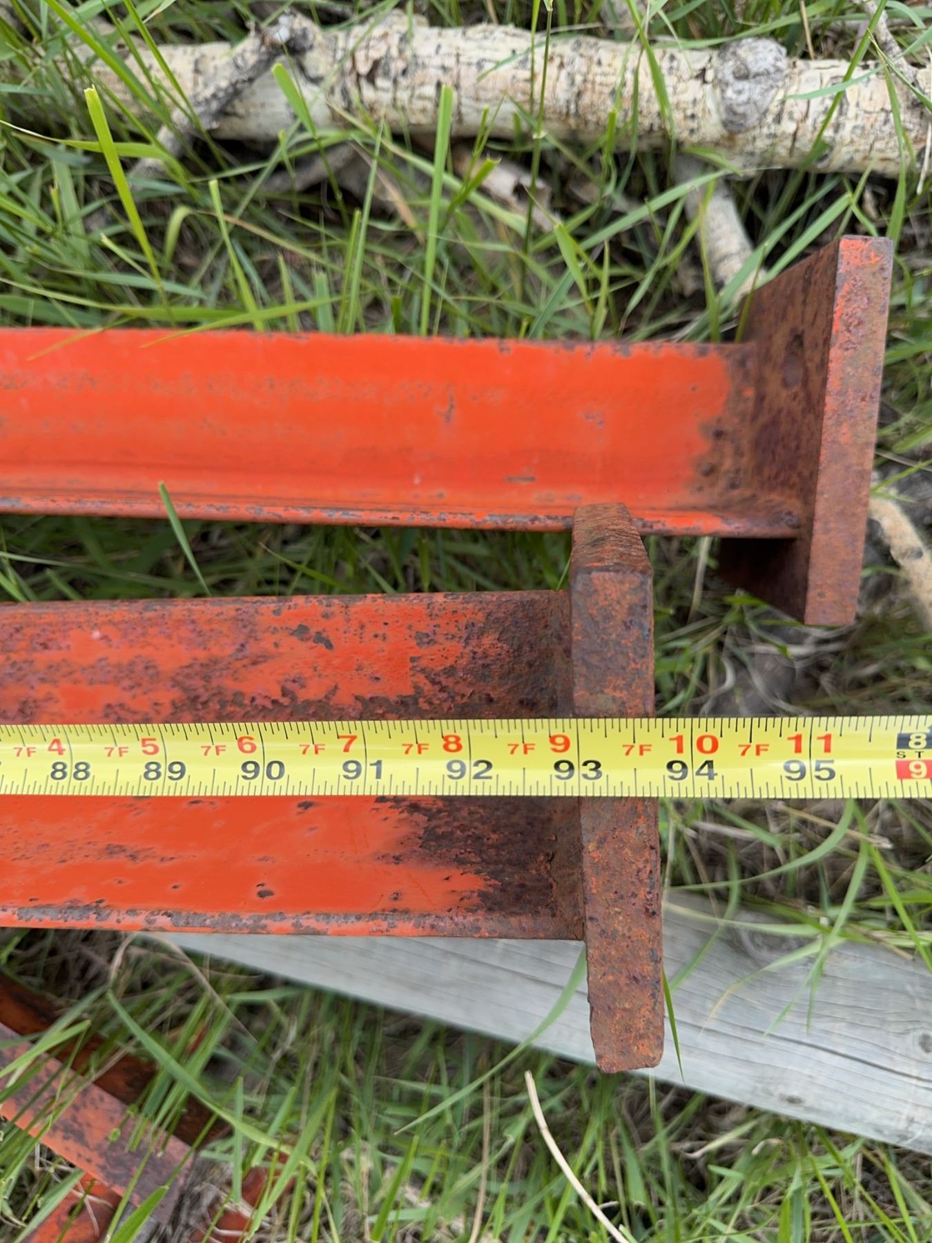 Steel feed stand I-beams with orange paint, each beam measuring ...