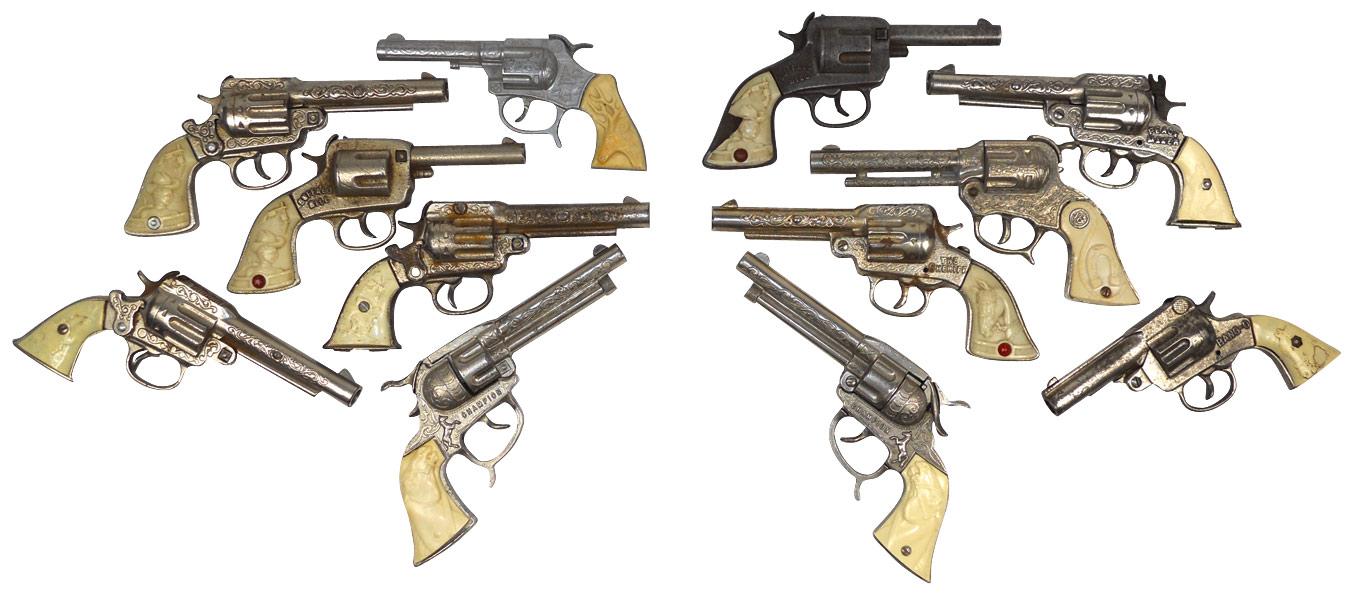 Toy cap guns (12), 2 Gene Autry Champion cap guns, Peace Makers, Red ...