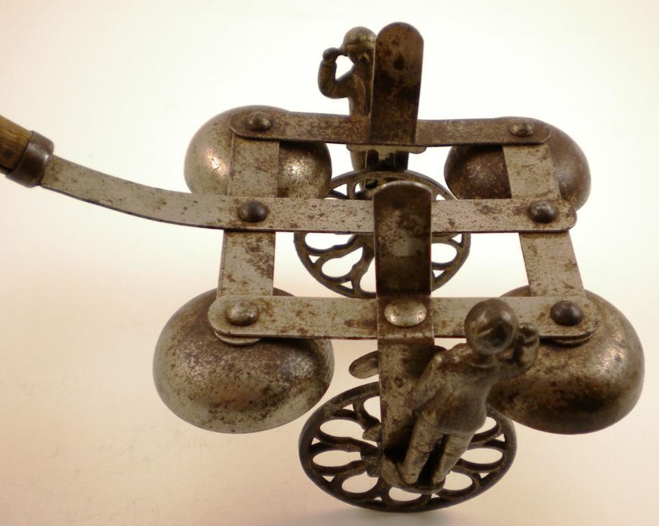 Cast Iron Push Toy with Bells & Figures