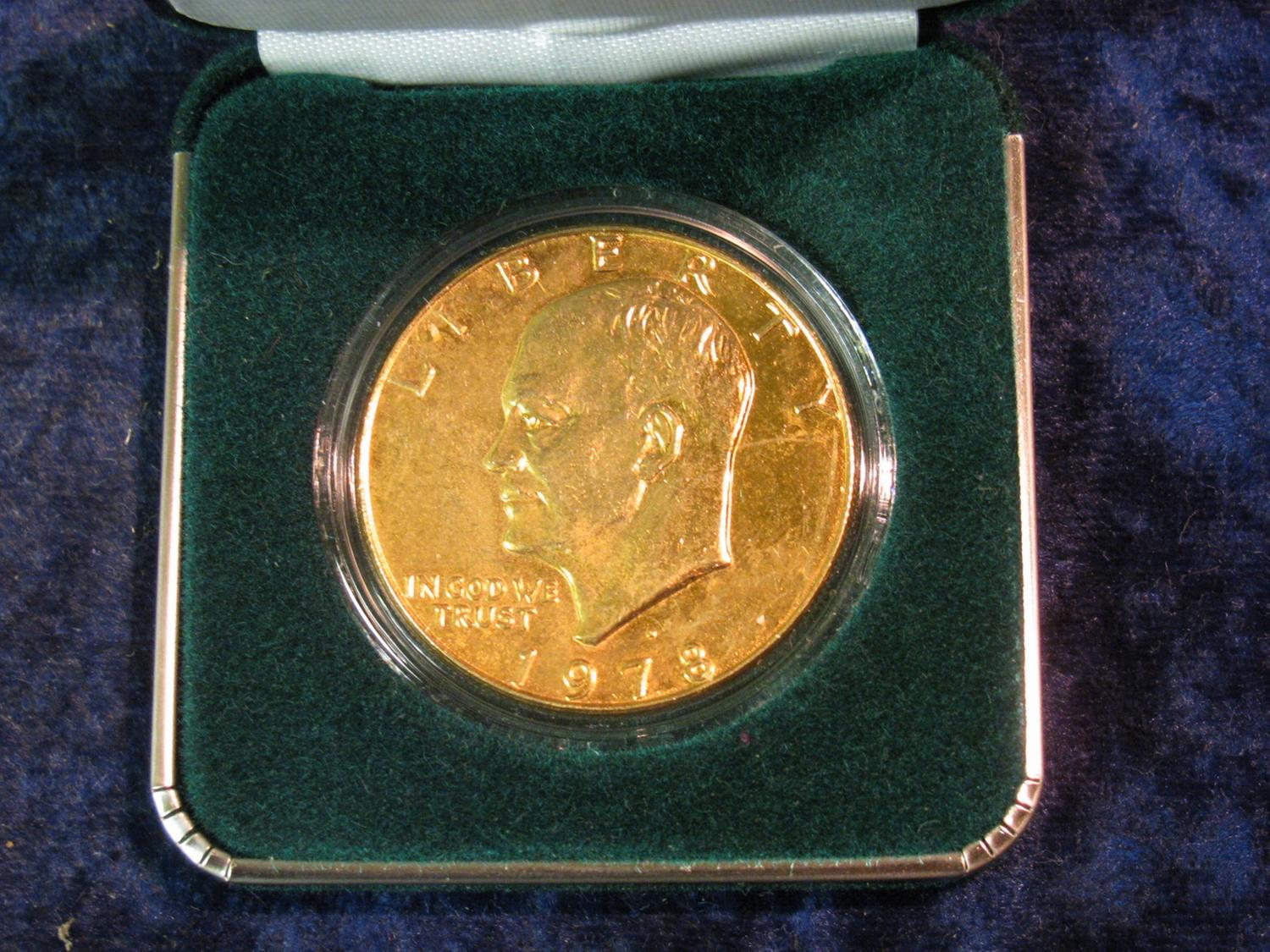 350. 1978 D Gold-plated Eisenhower Dollar in velvet-lined case.