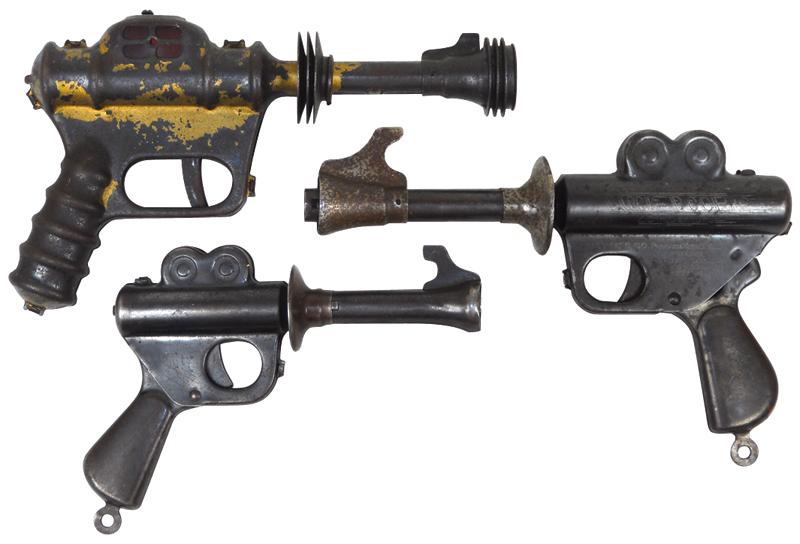Toy guns (3), cast metal Buck Rogers 25th Century ray guns (2) & Atomic ...