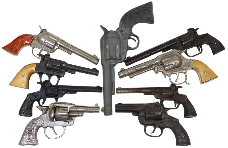 Toy guns (9), cast metal pistols, includes 45 Smoker, Kit Carson ...