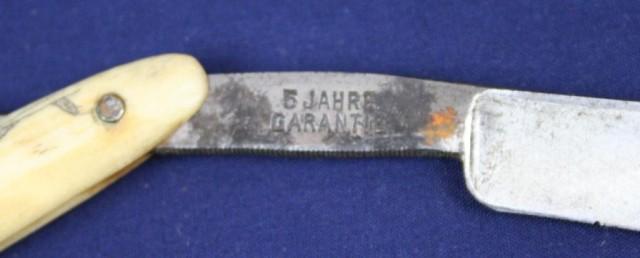 SCRIMSHAW BONE HANDLED STRAIGHT RAZOR