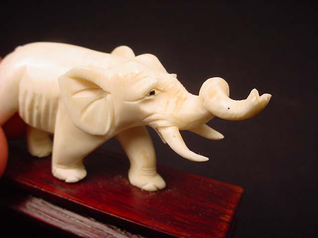 VINTAGE IVORY CARVED ELEPHANT FIGURINE W/ WOOD BAS