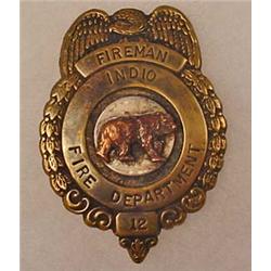 VINTAGE INDIO FIRE DEPARTMENT FIREMAN NO. 12 BADGE
