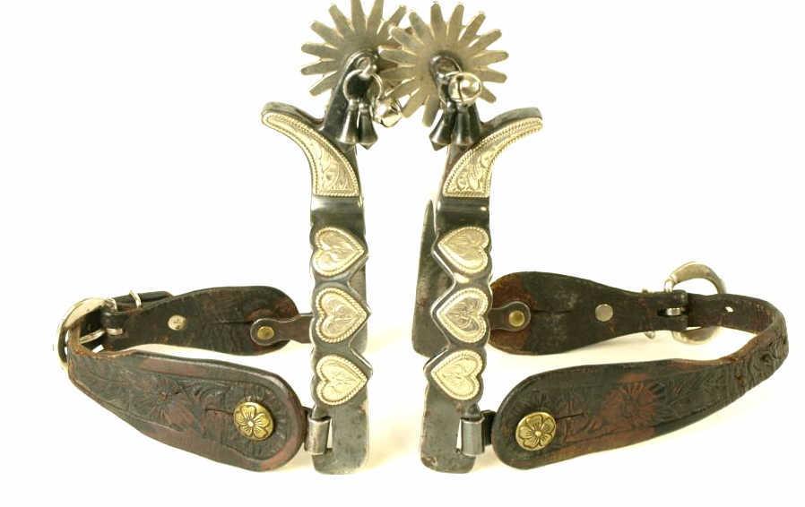Contemporary unmarked drop shank spurs in classic heart pattern with ...
