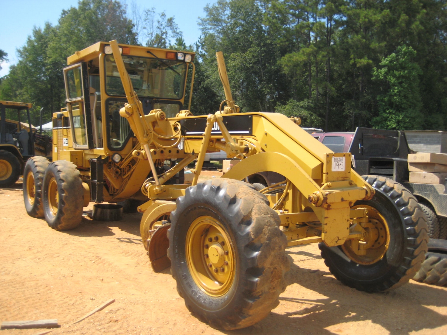 CAT 120H MOTOR GRADER - J.M. Wood Auction Company, Inc.