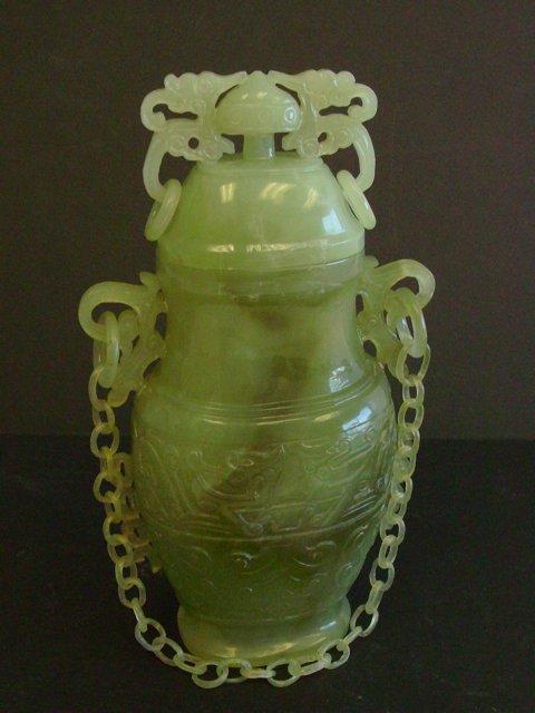 Carved jade urn with jade chain