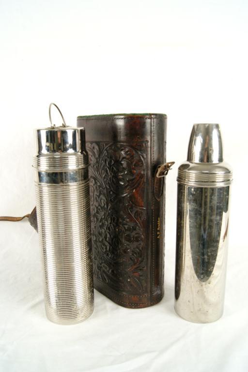 Vintage stainless thermos in tooled leather case