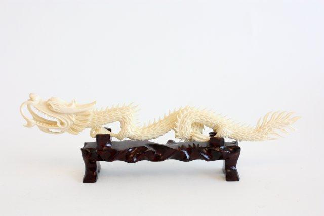 Chinese ivory "Dragon" on wood base