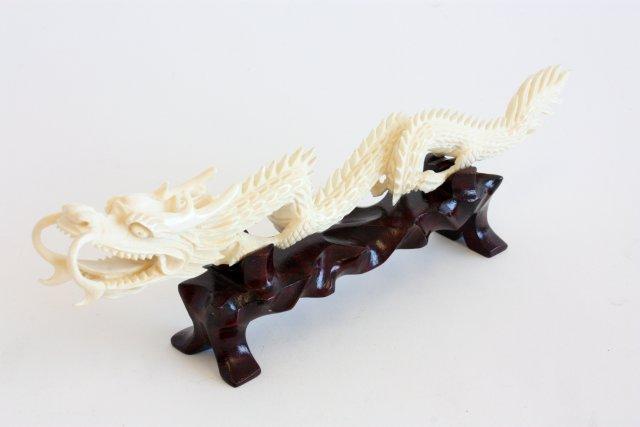 Chinese ivory "Dragon" on wood base