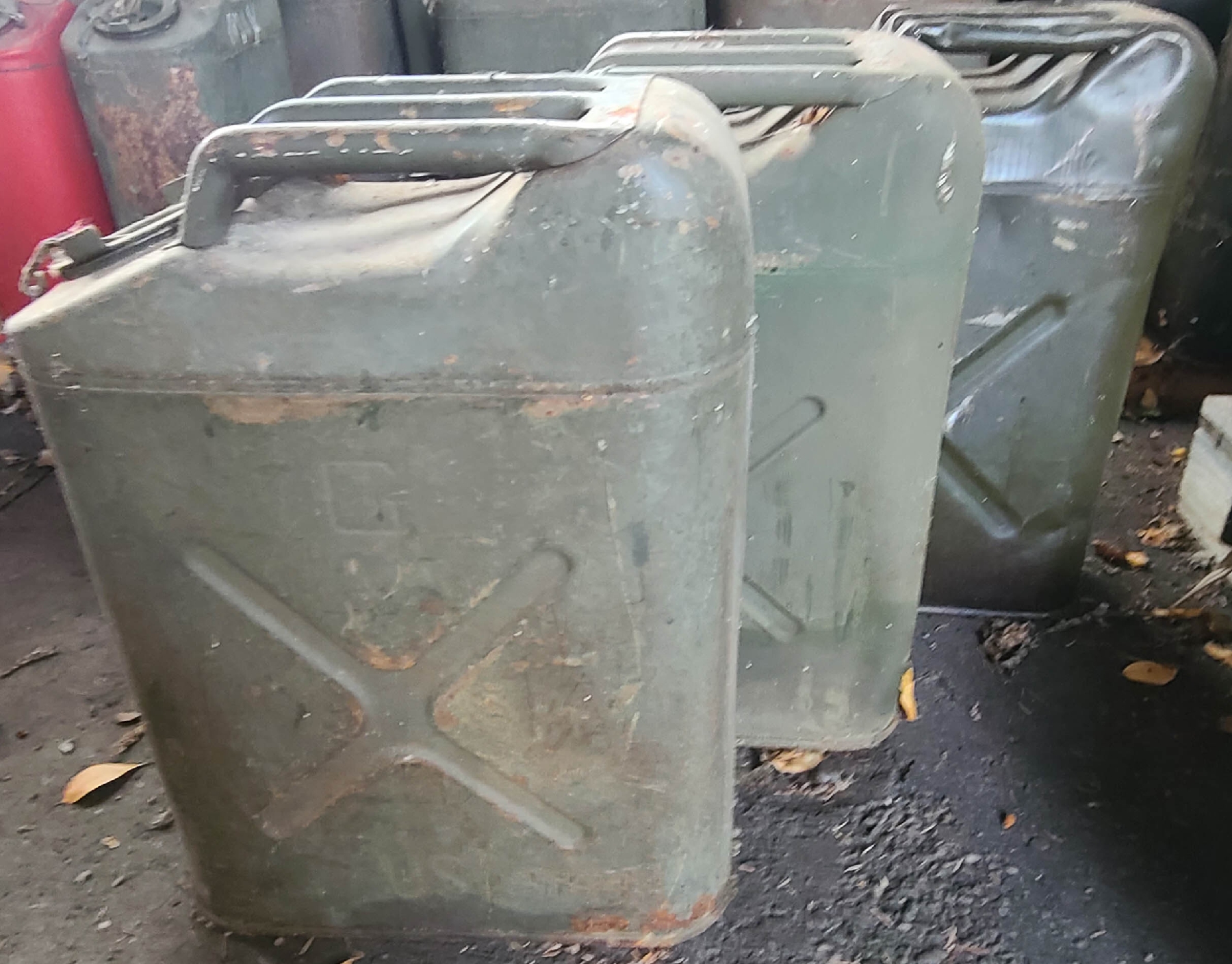 THREE 5 GALLON MILITARY FUEL CANS
