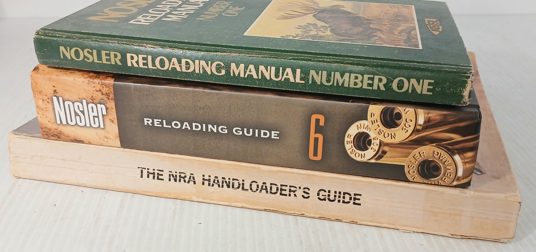 LOT OF 3 - "NOSLER RELOADING MANUAL NO. 1", "NOSLER RELOADING GUIDE 6 ...