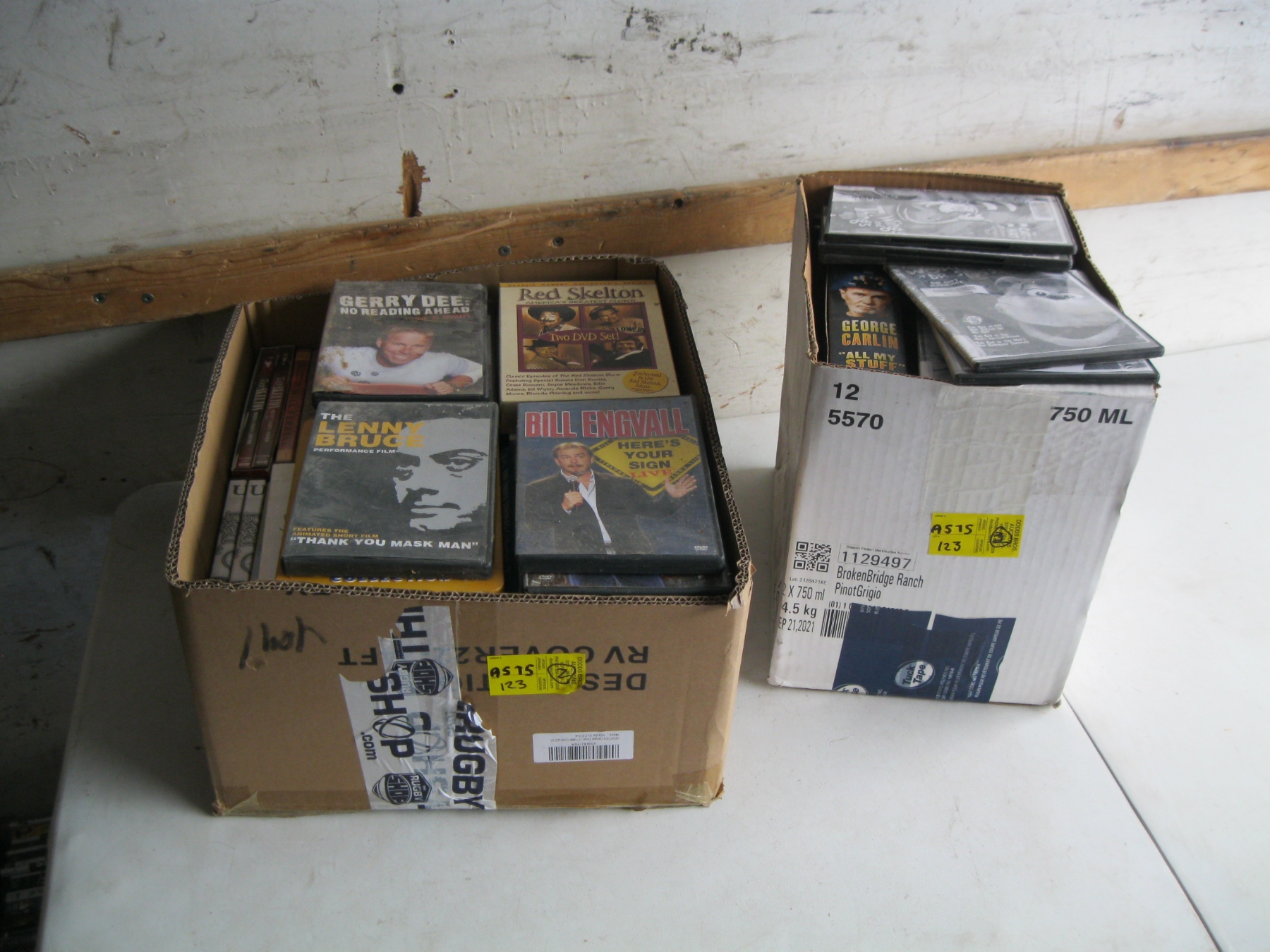 2 BOXES OF DVDs
