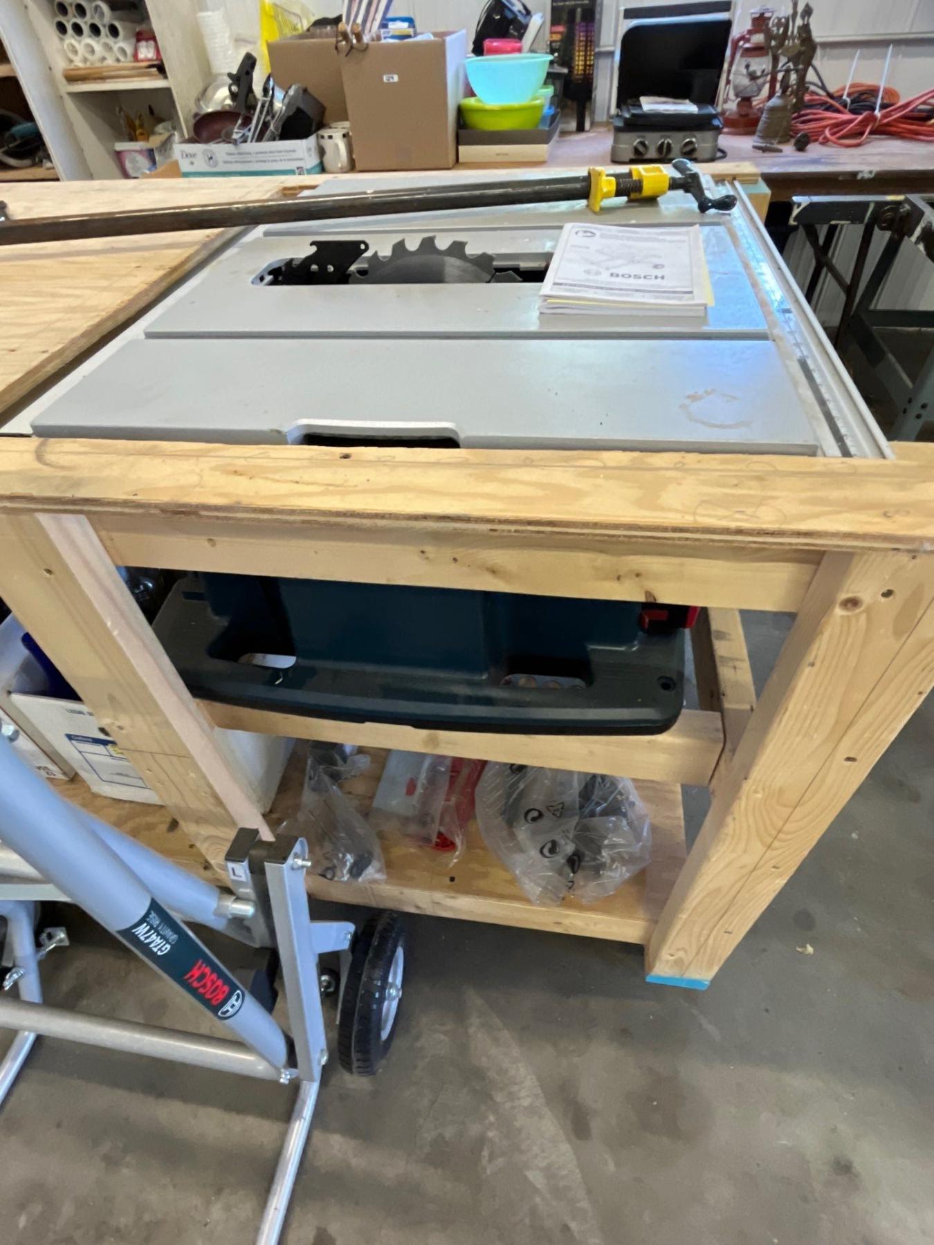BOSCH table saw with original cart never used and homemade workbench ...
